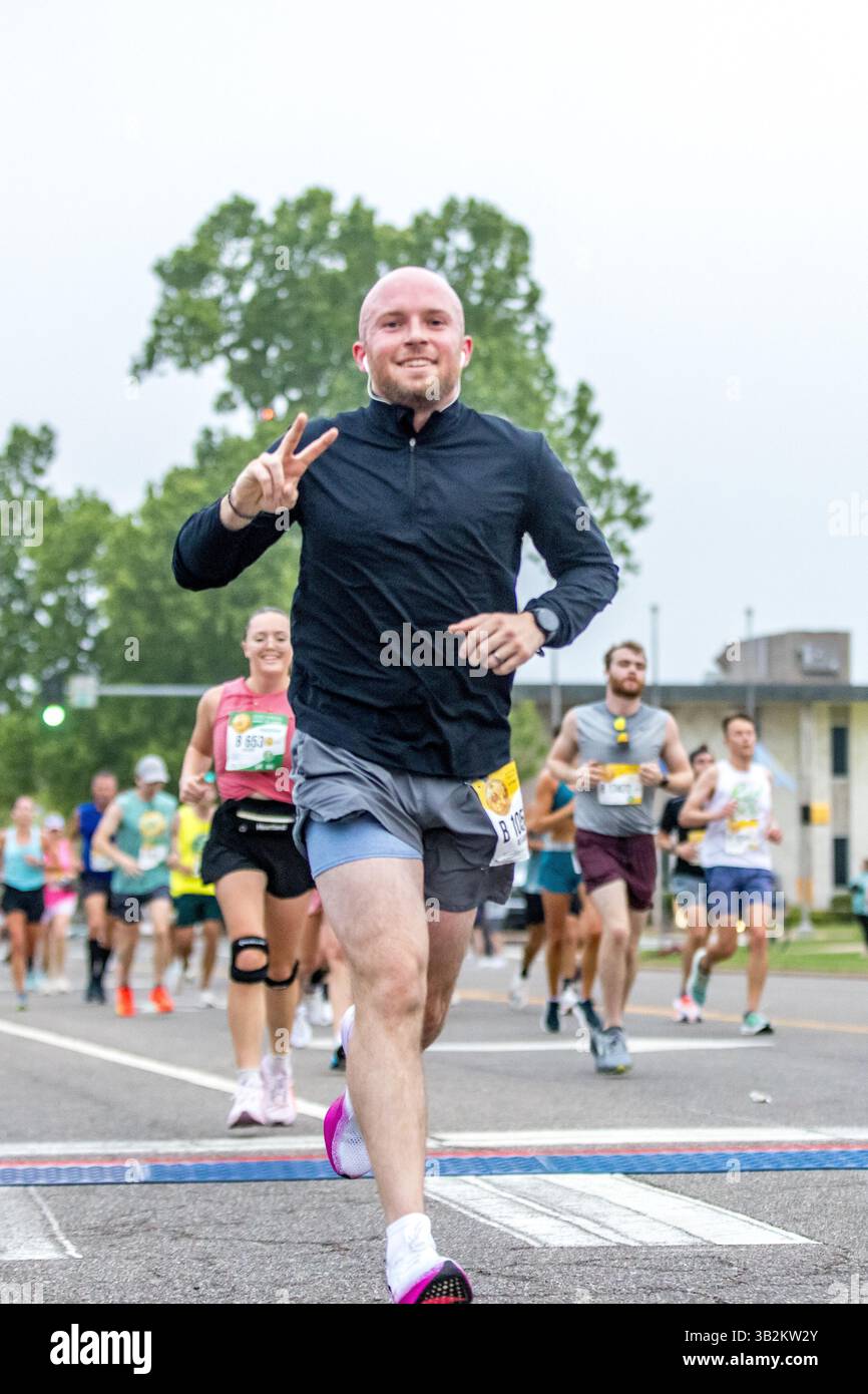 Runners cross the 5K mark during the 25th annual Oklahoma City Memorial Marathon in Oklahoma ...