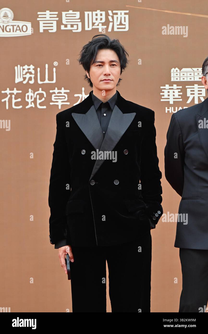 Chinese actor, singer and producer Chen Kun poses on the red carpet at ...