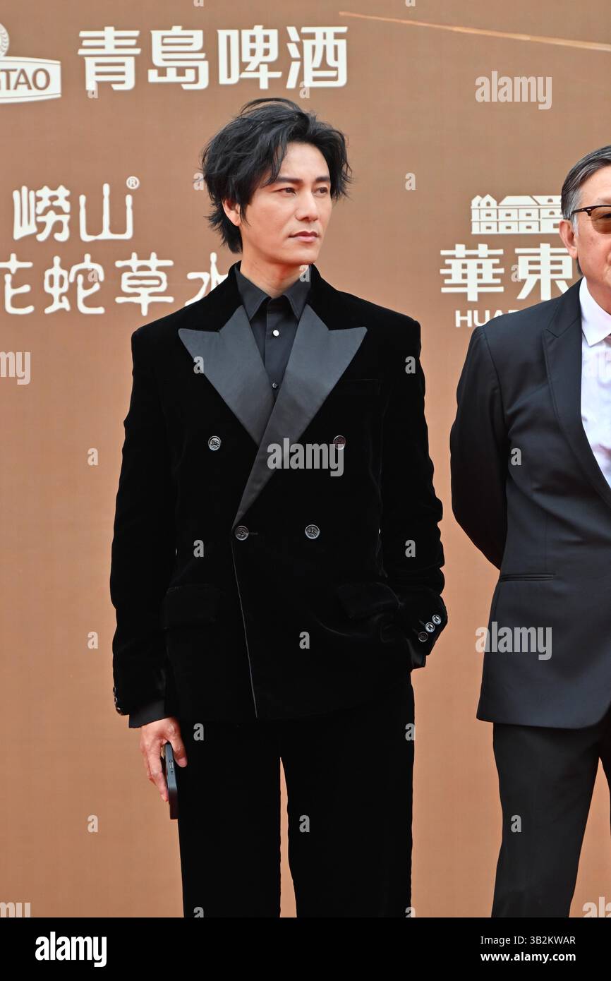 Chinese actor, singer and producer Chen Kun poses on the red carpet at ...