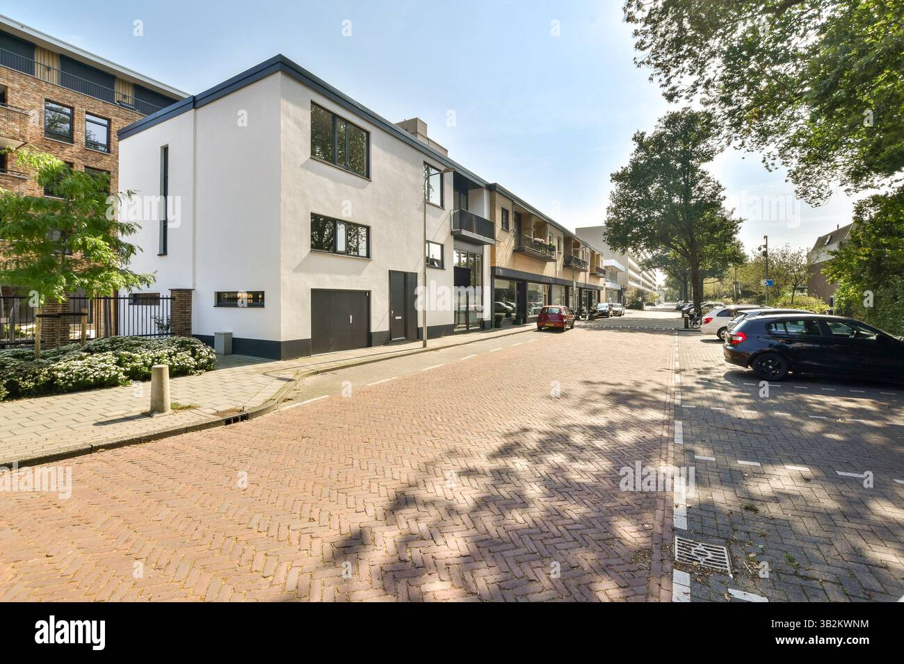 A vibrant urban setting featuring contemporary buildings along a clean ...