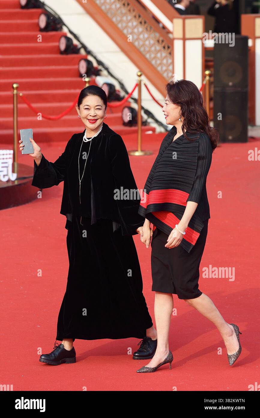 Actresses Ni Peng (L) and Yue Hong walk the red carpet. Beijing,China.26th April 2025. The 15th ...