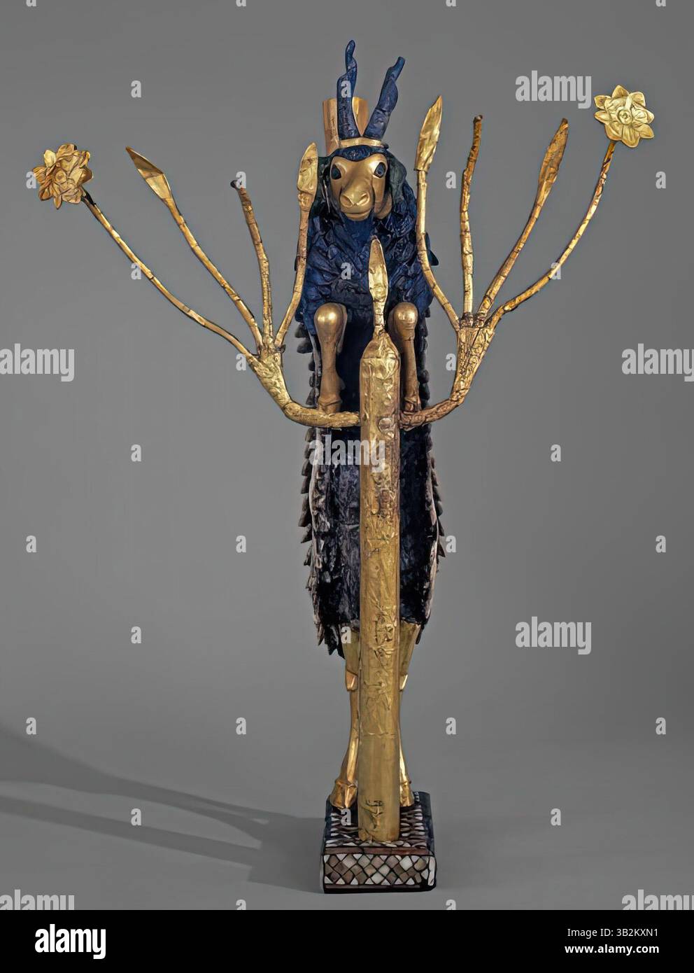5240. GOLD COATED GOAT WITH HIS FORELEGS LEANING ON A TREE, REMINISENT ...