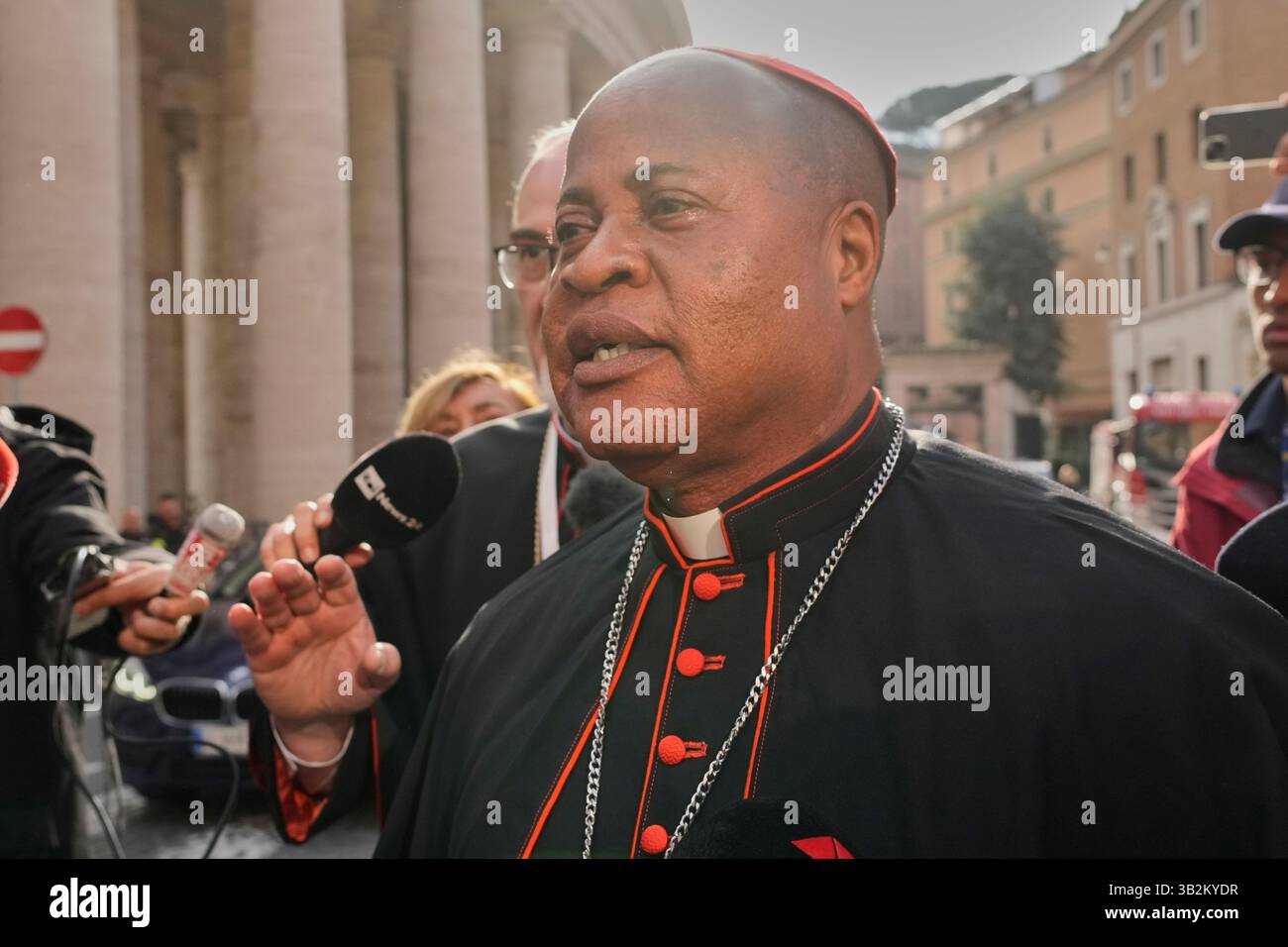 Cardinal Fridolin Ambongo Besungu, followed by Cardinal Pierbattista ...