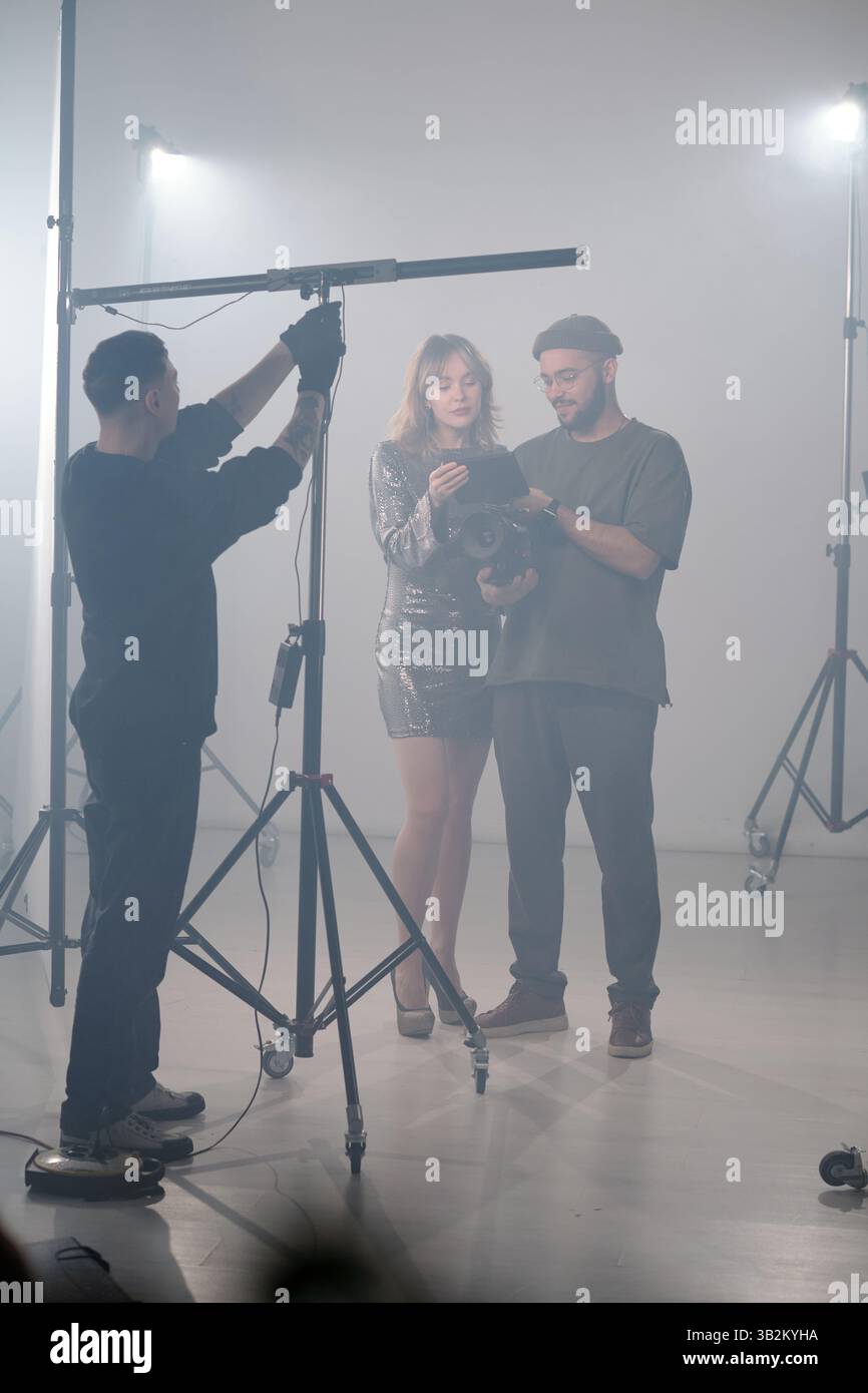 Director Are Reviewing Footage on Monitor during Video Shoot Stock ...