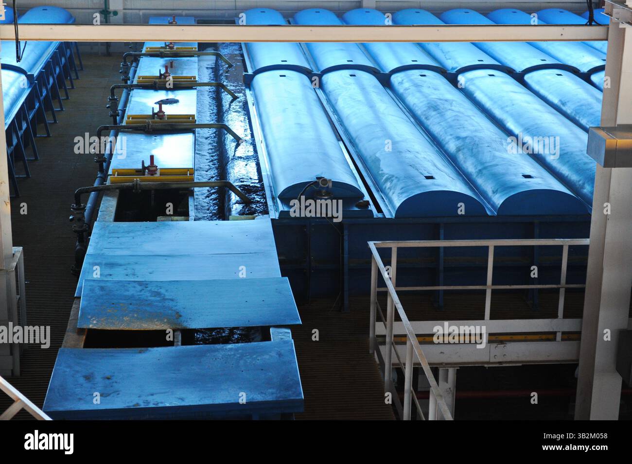 The metal hoists are arranged in a row in the copper cathode cleaning ...