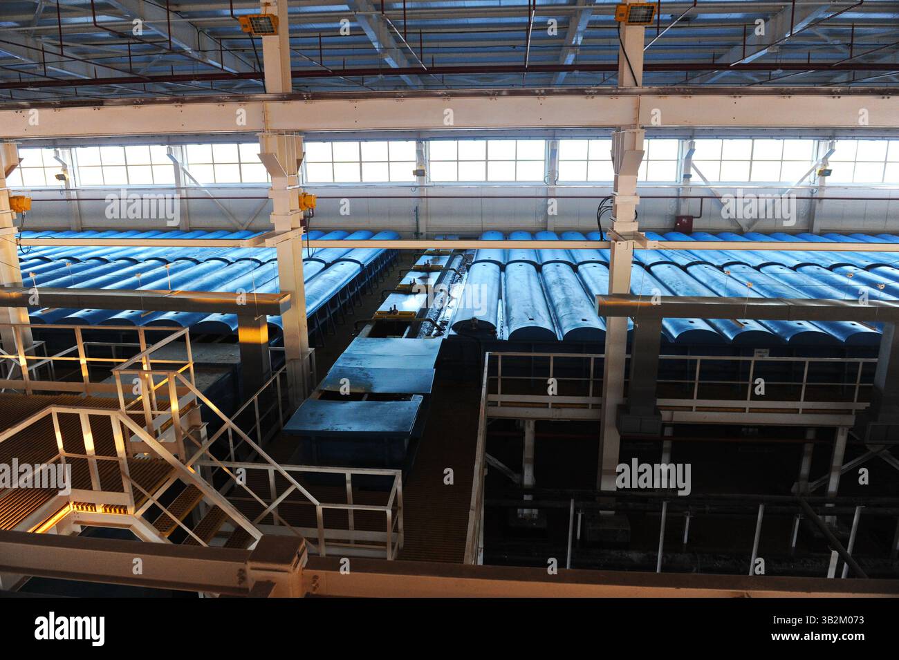 The metal hoists are arranged in a row in the copper cathode cleaning ...