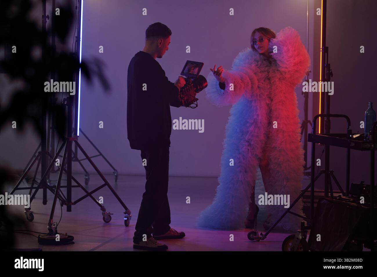 Studio Filming Setup with Woman Performing In Costume Stock Photo - Alamy