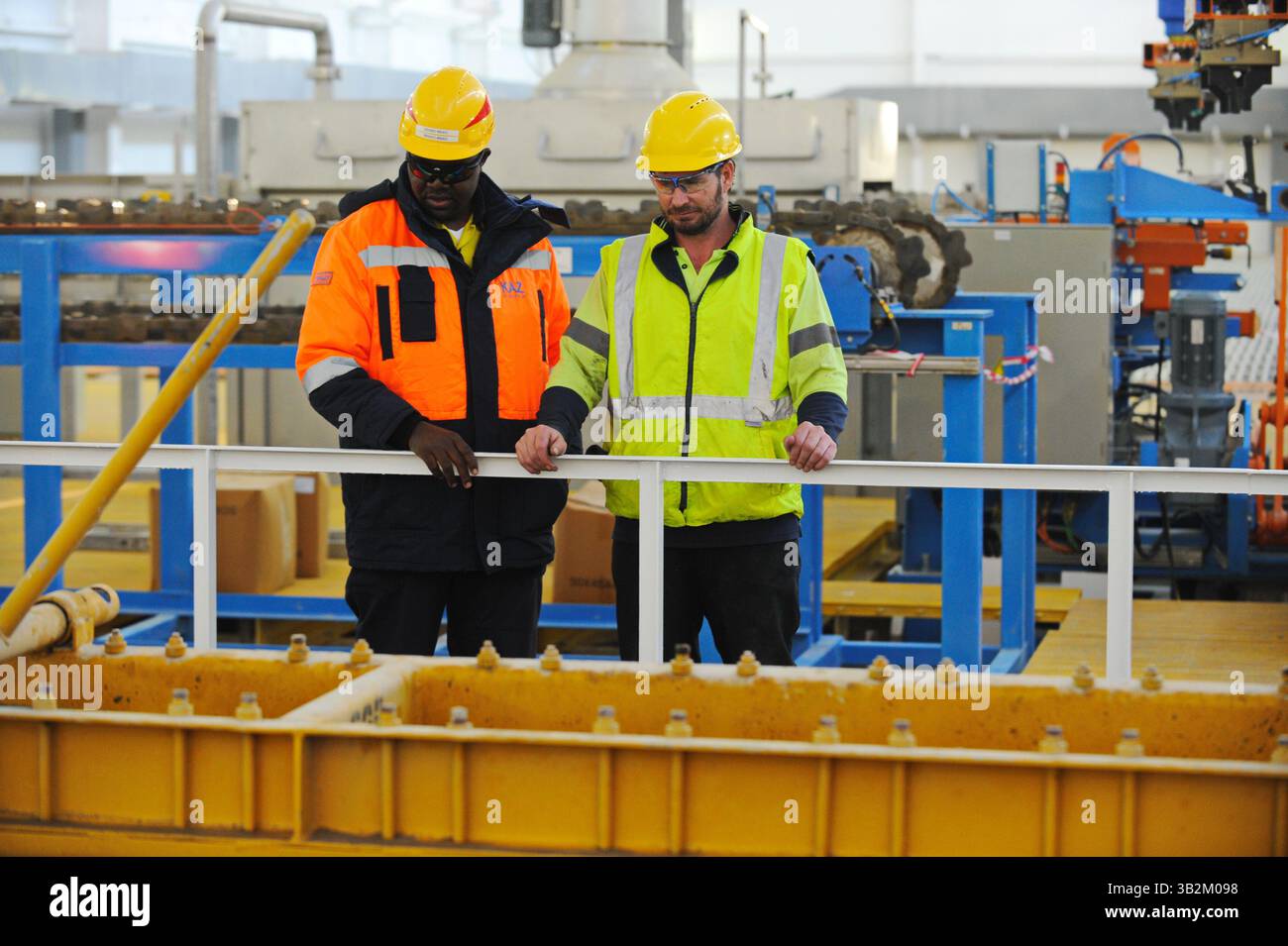 Workers fix and prepare layers of cathode copper at the plant Stock ...