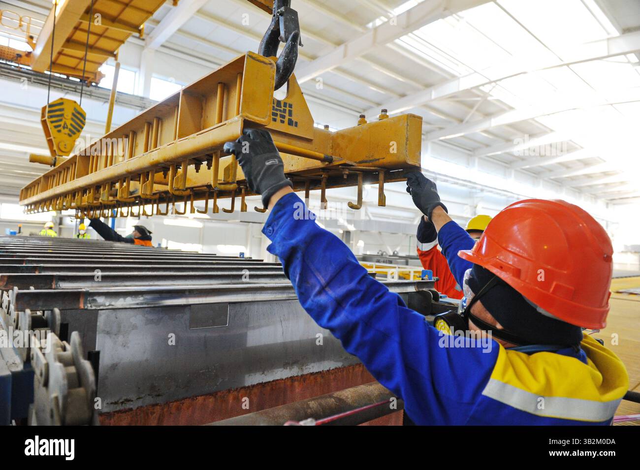 Workers fix and prepare layers of cathode copper at the plant Stock ...