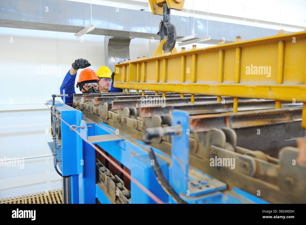 Workers fix and prepare layers of cathode copper at the plant Stock ...