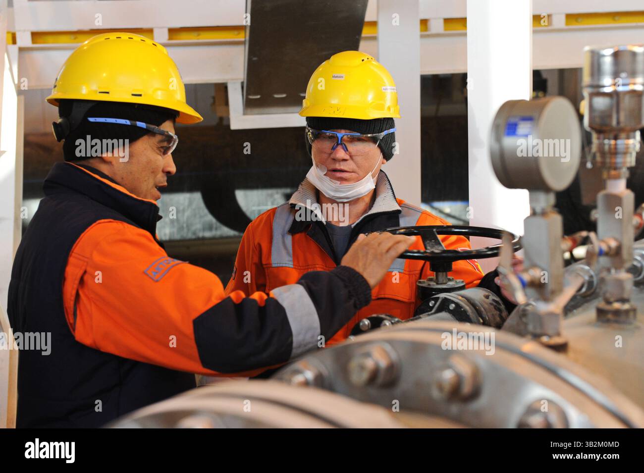 Workers fix and prepare layers of cathode copper at the plant Stock ...