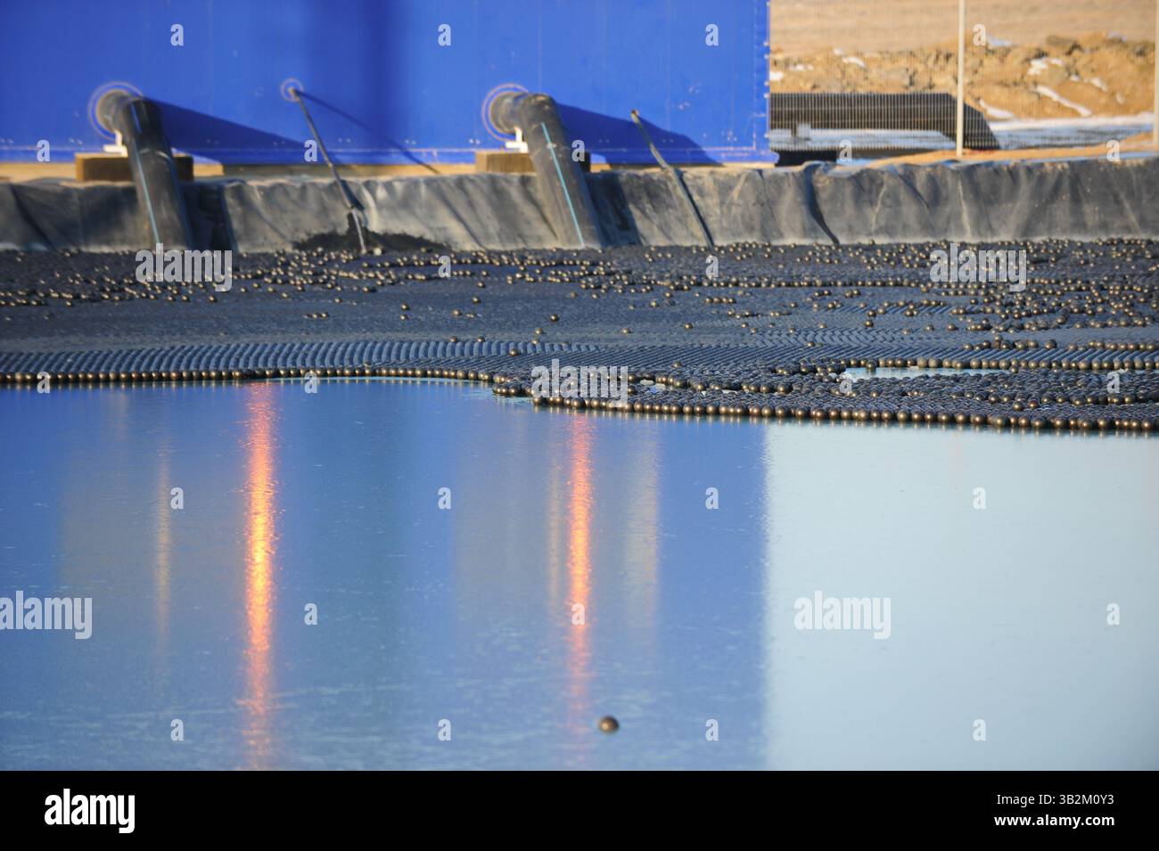 The chemical tank is covered with plastic balls to slow evaporation at ...