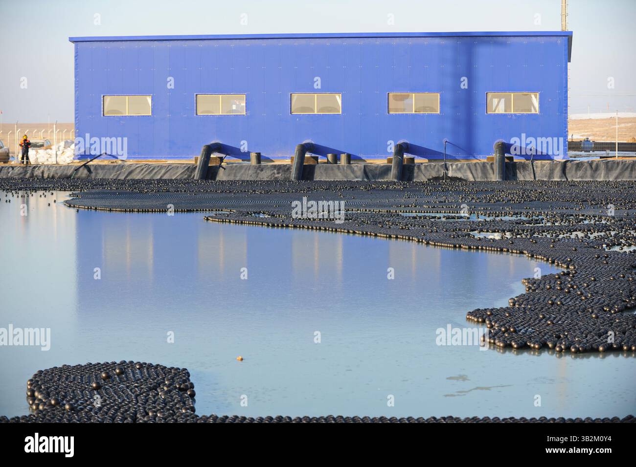 The chemical tank is covered with plastic balls to slow evaporation at ...