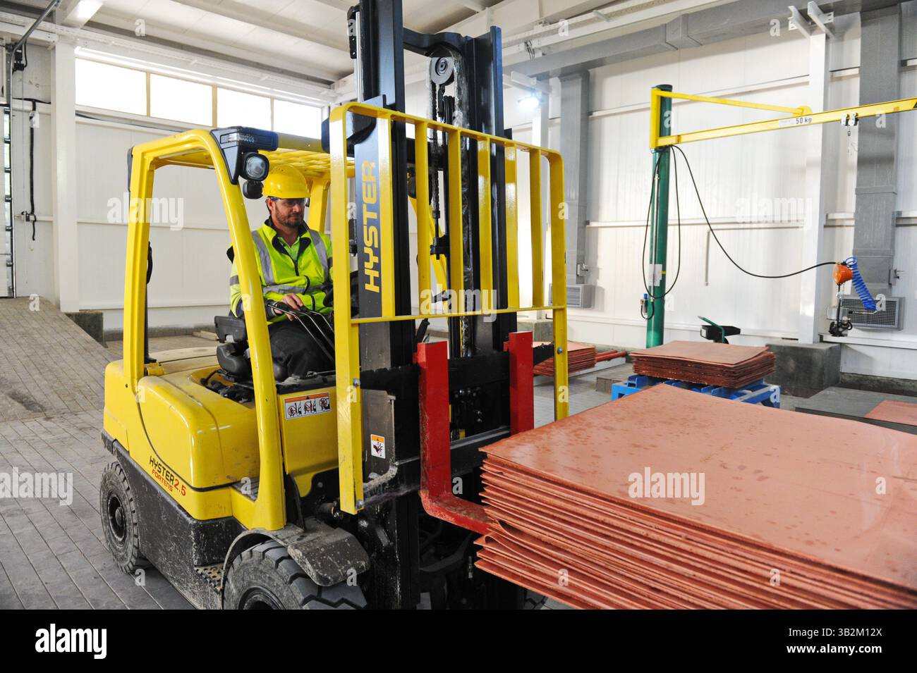 Workers fix and prepare layers of cathode copper at the plant Stock ...