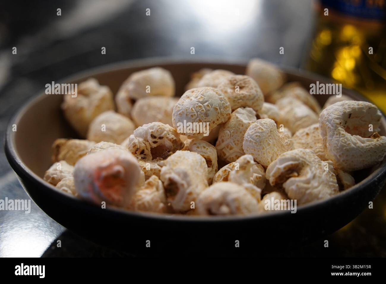 A traditional Korean snack similar to popcorn, made from puffed corn ...