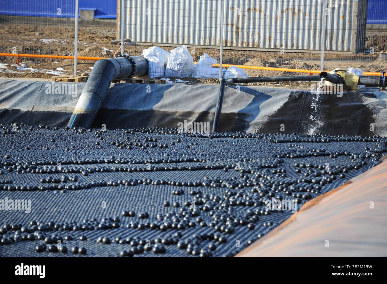 The chemical tank is covered with plastic balls to slow evaporation at ...