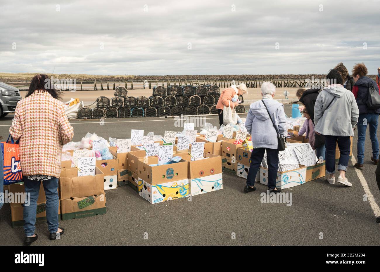 People shopping at Amble Quayside Sunday Market, Amble, Northumberland ...