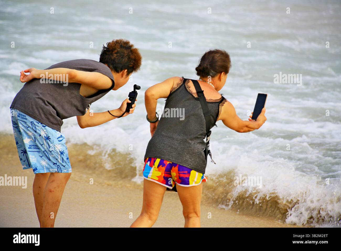 Tourists enjoy vacation at Dadonghai Bay Scenic Area in Sanya City ...