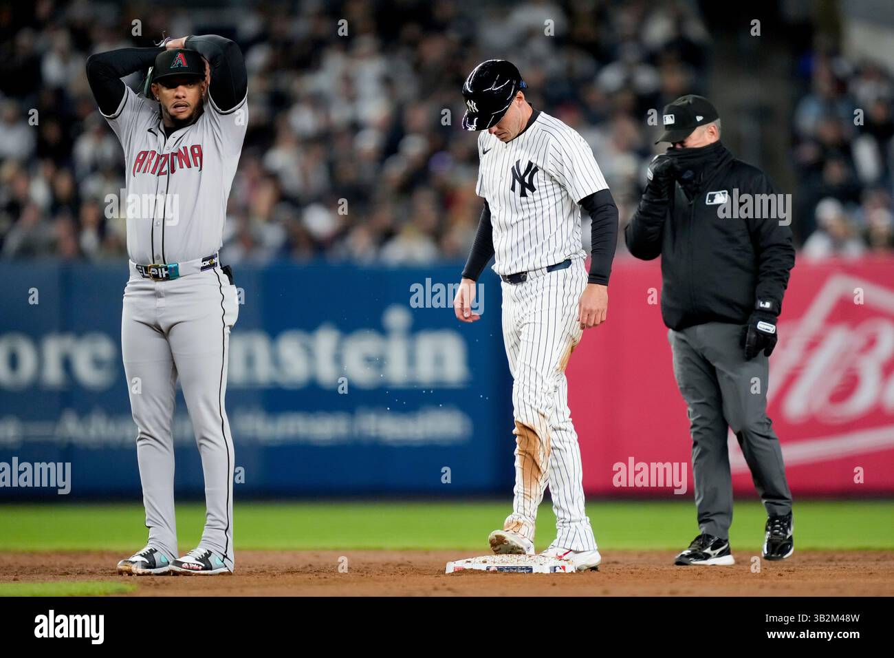 New York Yankees' Cody Bellinger, center, stands at second base during ...