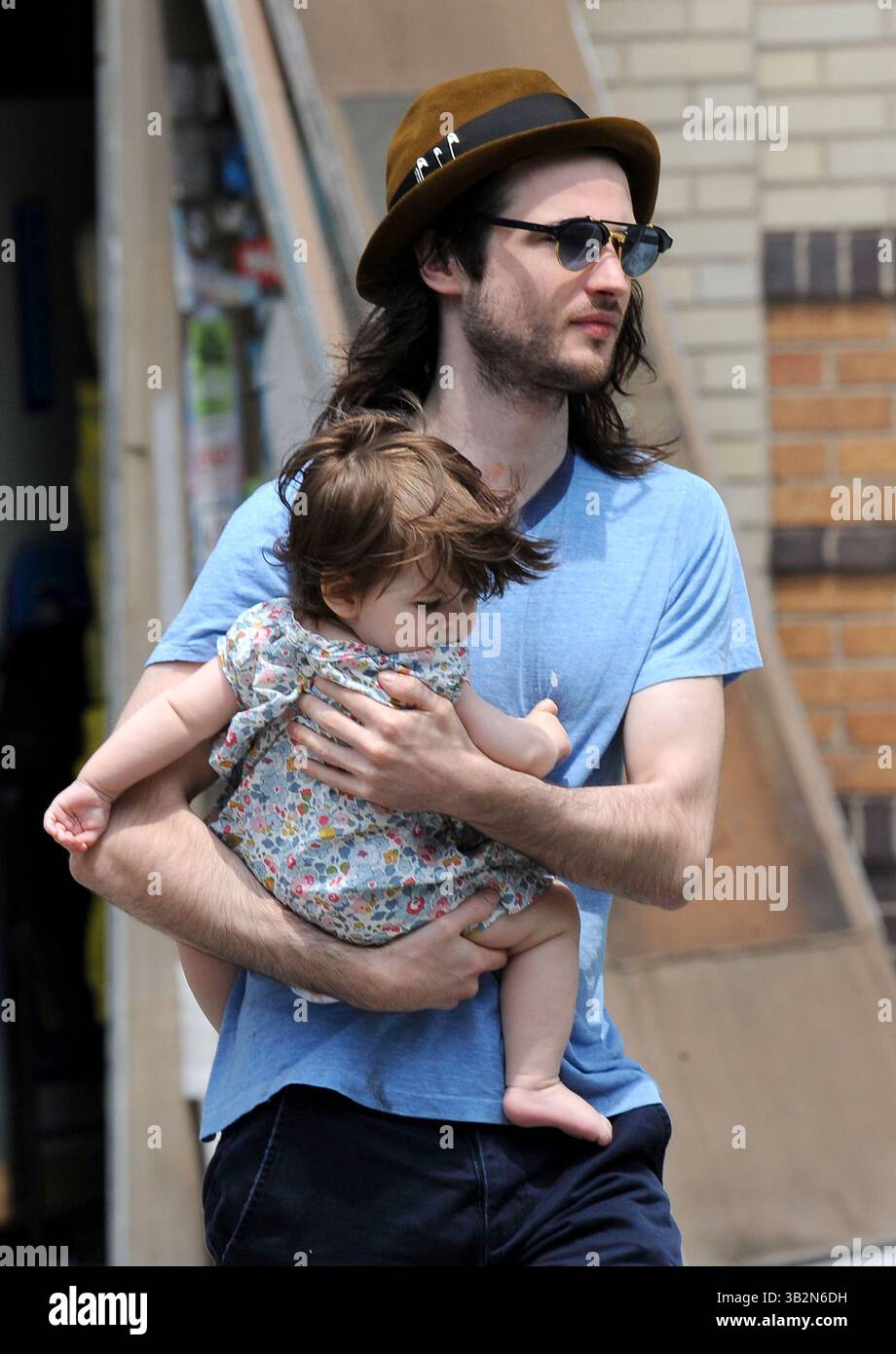 Tom Sturridge and his daughter Marlowe go to the playground in the West ...