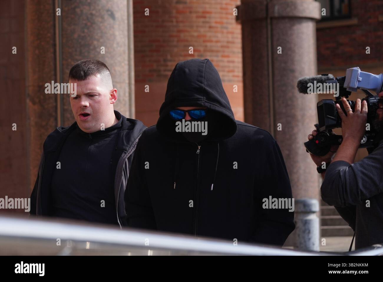 Adam Carruthers (right) arrives at Newcastle Crown Court where he is ...