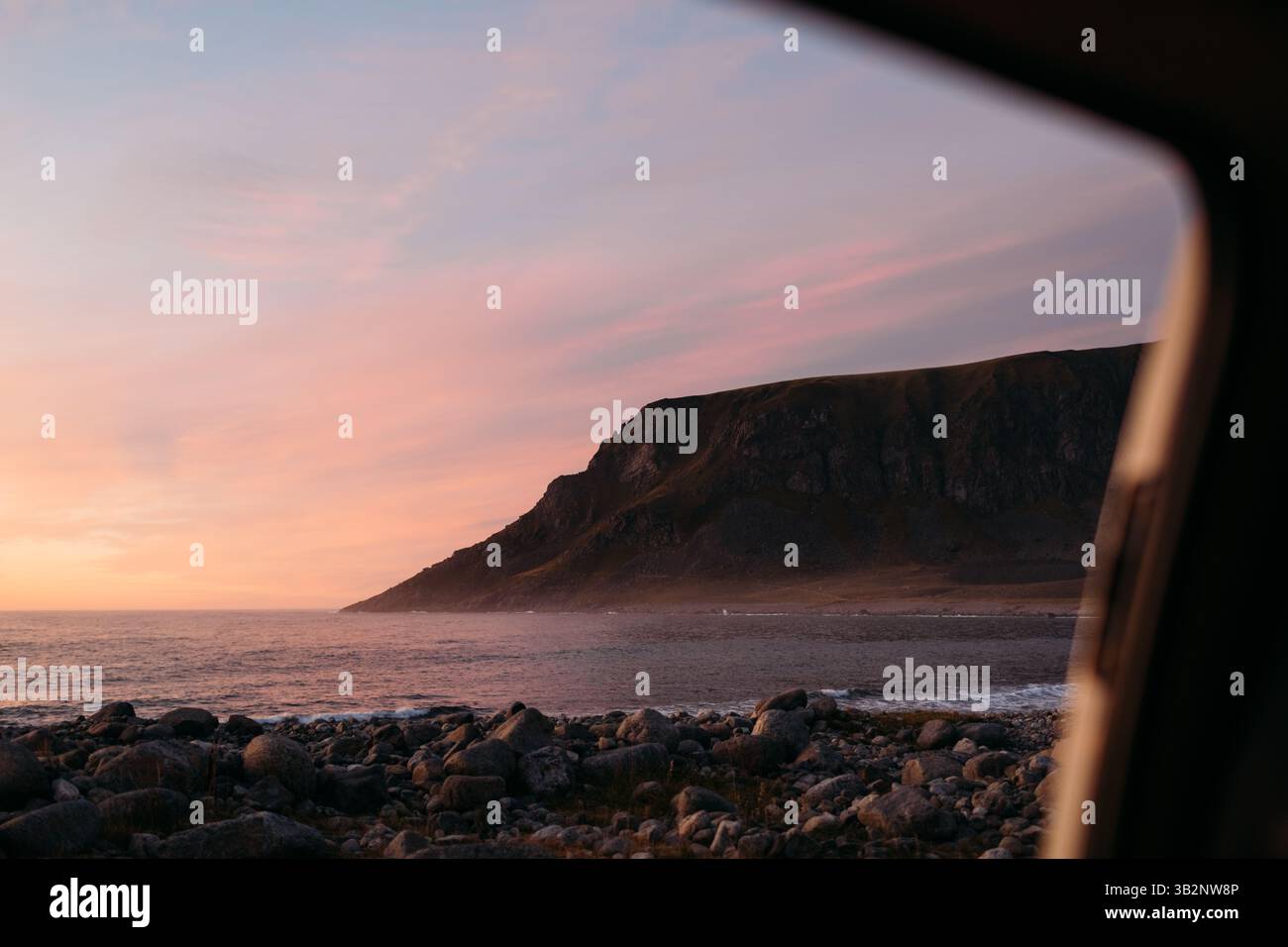 Rocky coastline and cliffs at dusk through van window Stock Photo - Alamy