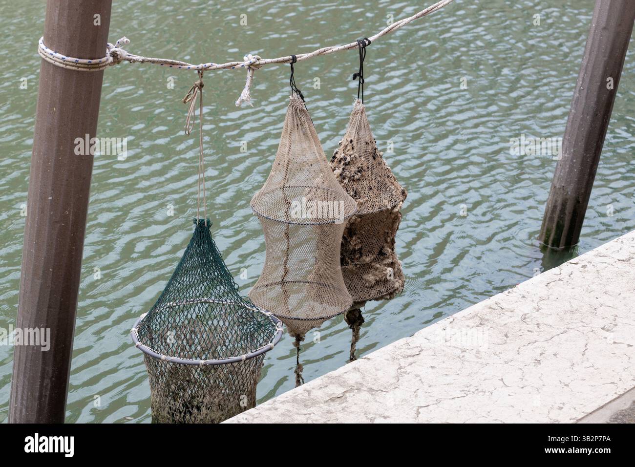 Traditional fishing nets hanging hi-res stock photography and images ...