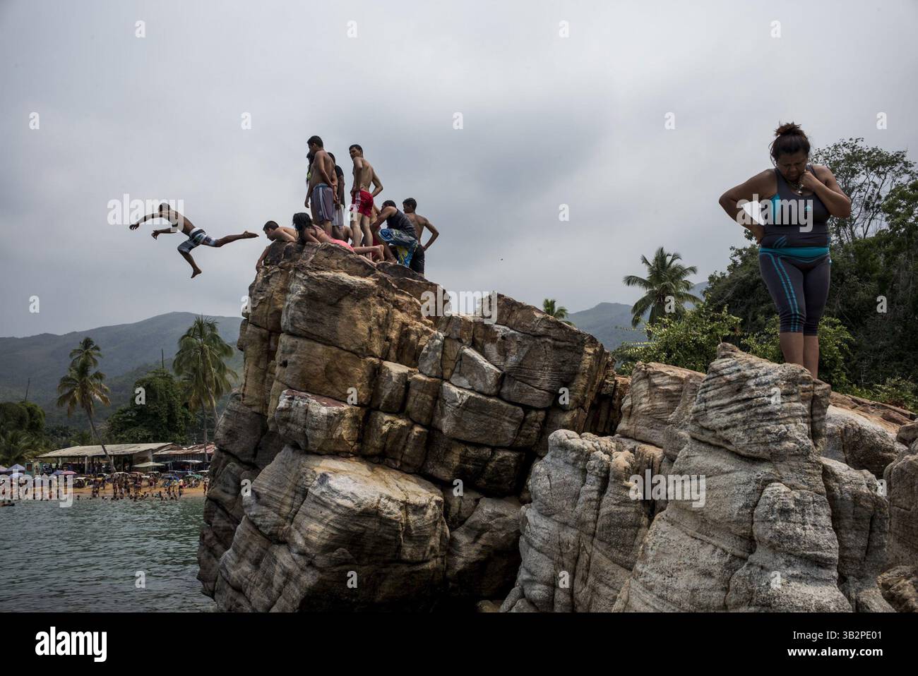 Oct. 11, 2015 - Puerto La Cruz, Venezuela - Teenagers jump off rocks at ...