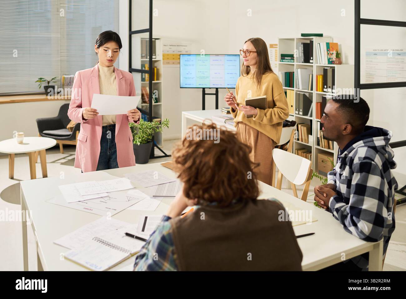 Studying Languages in Modern Classroom Setting Stock Photo - Alamy