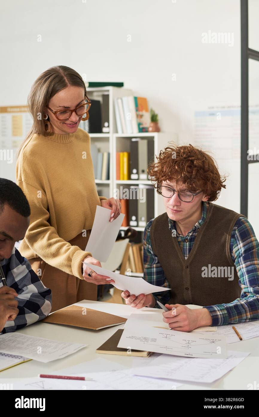 Studying Foreign Languages Around Classroom Table Stock Photo - Alamy
