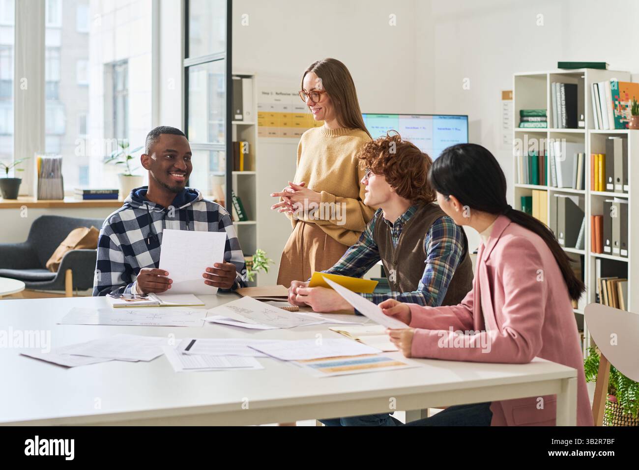 Teacher engaging students in classroom hi-res stock photography and ...