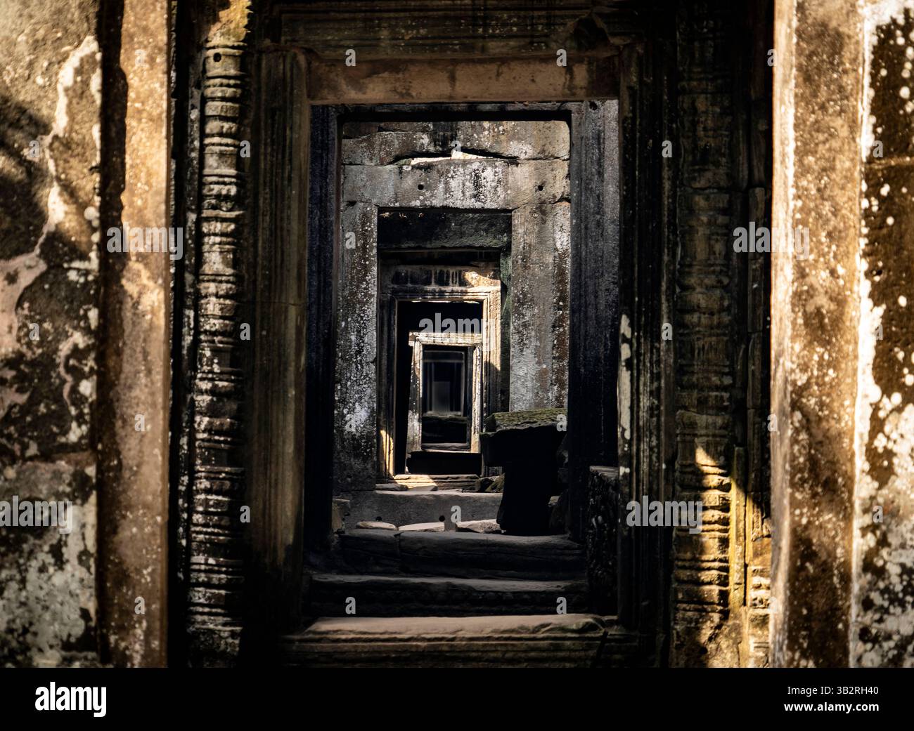 A series of ancient stone doorways leading into a dark corridor ...