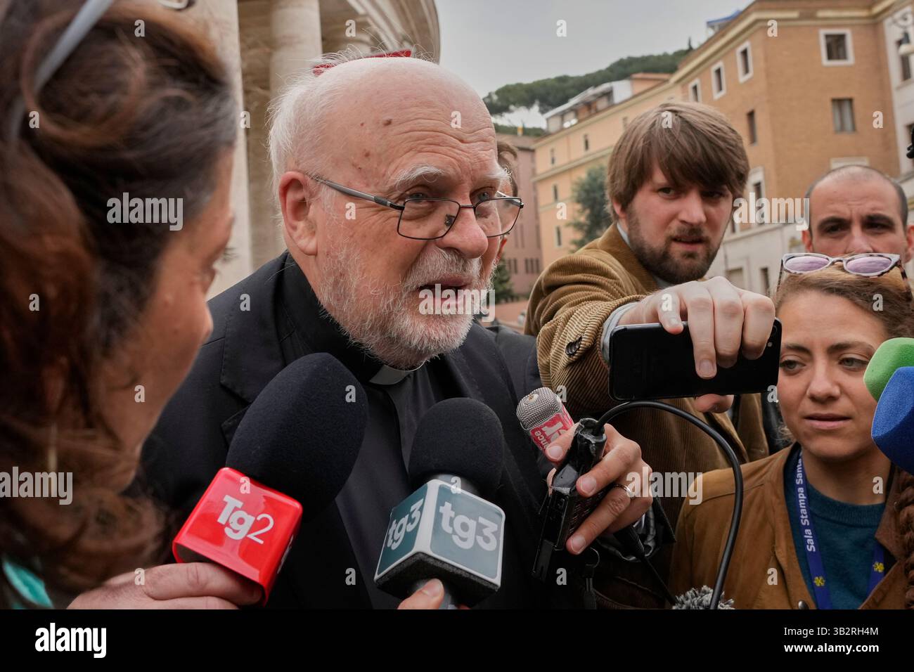 Swedish Cardinal Anders Arborelius is approached by reporters as he ...