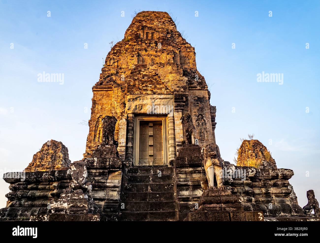 An ancient temple structure with intricate carvings and stone steps ...