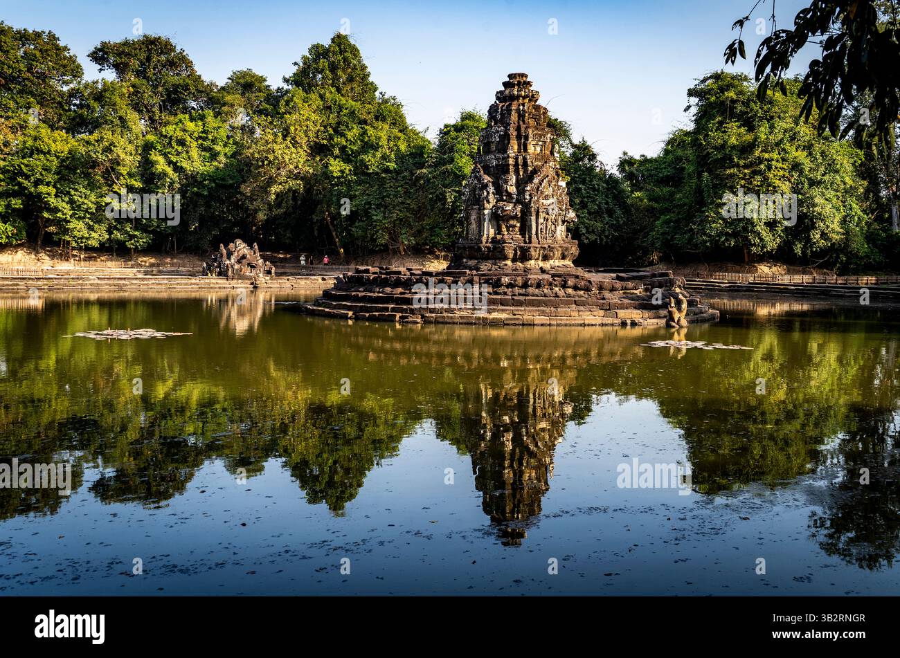 A serene landscape featuring a stone temple structure surrounded by a ...