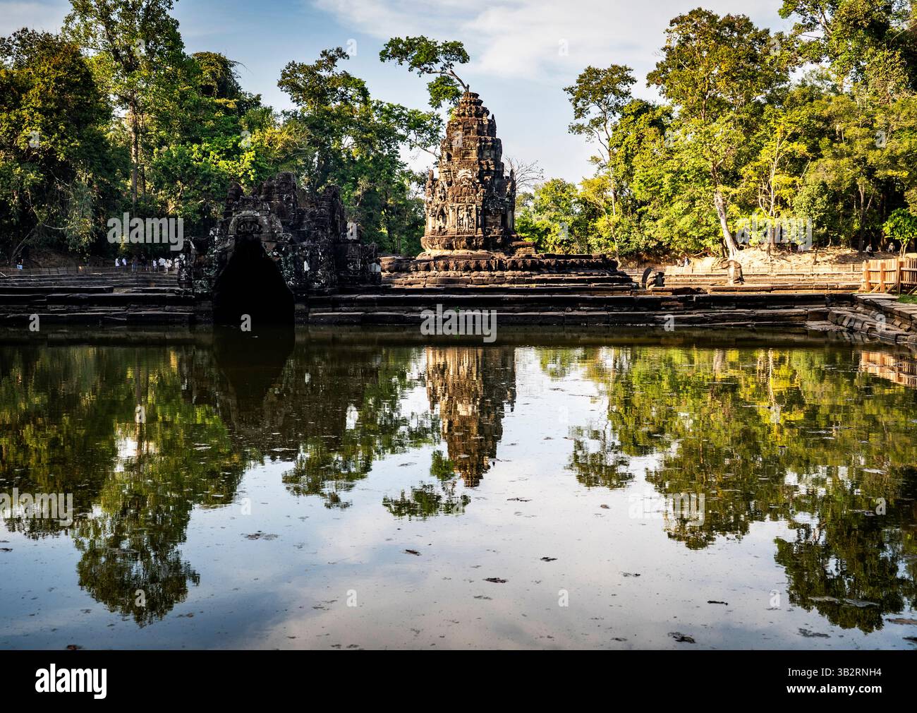 A serene view of an ancient temple surrounded by lush greenery ...