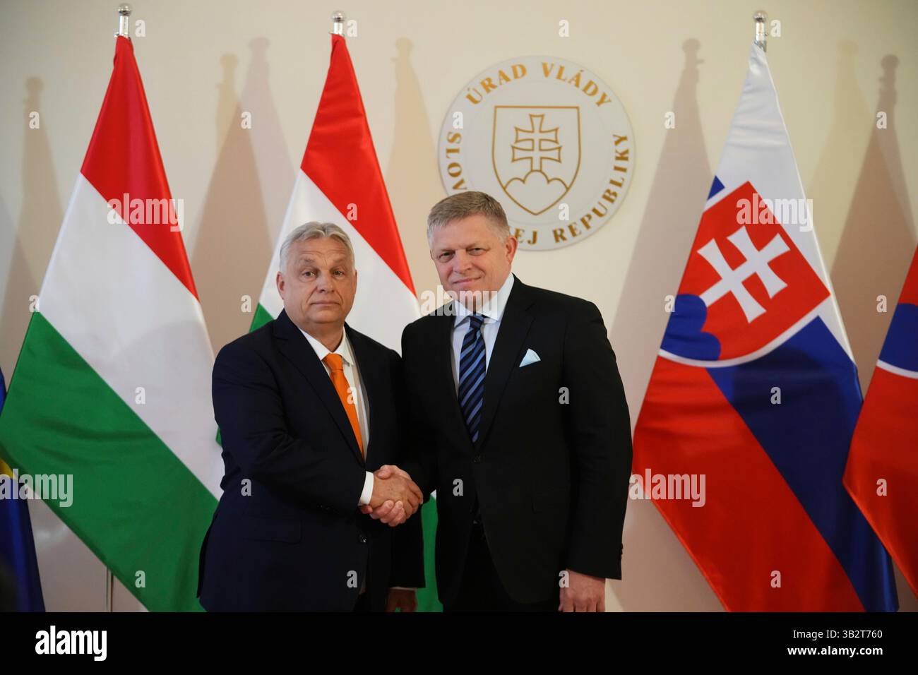 Slovakia's Prime Minister Robert Fico, right, welcomes his Hungarian ...
