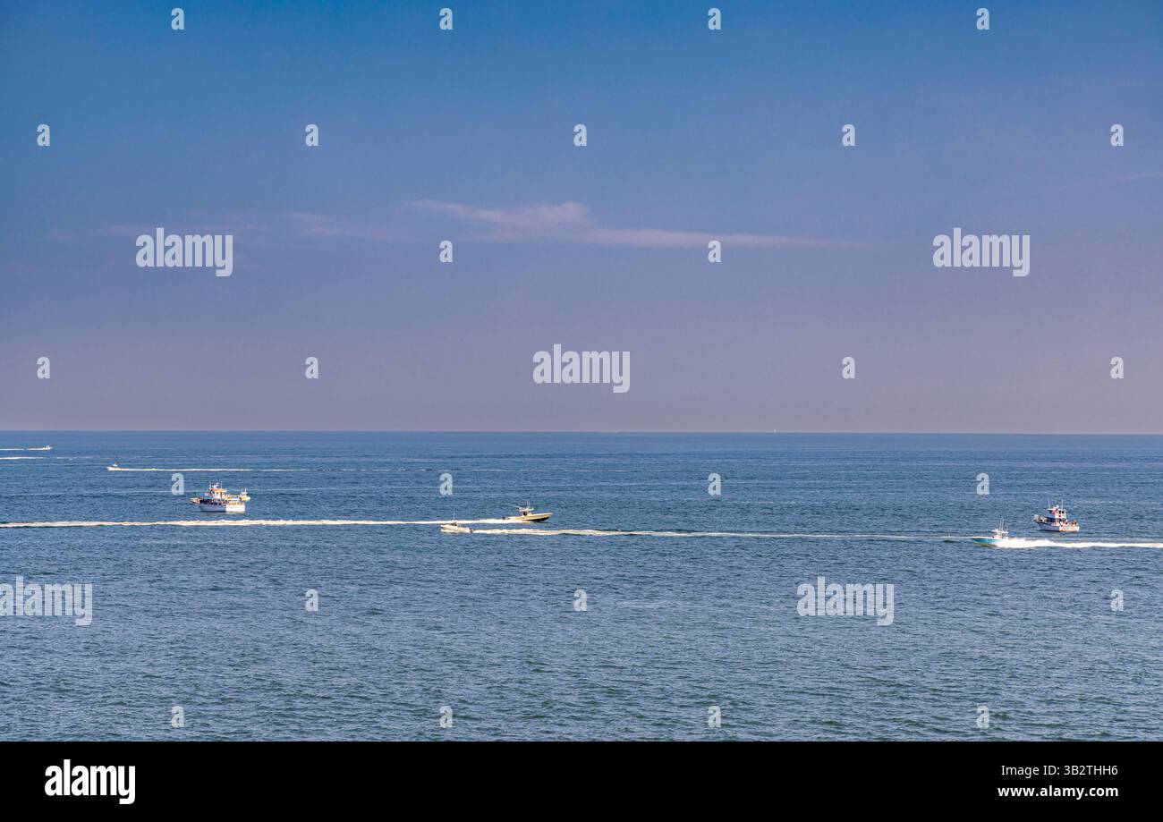 boats off montauk point with off shore wind farm in the distance Stock ...