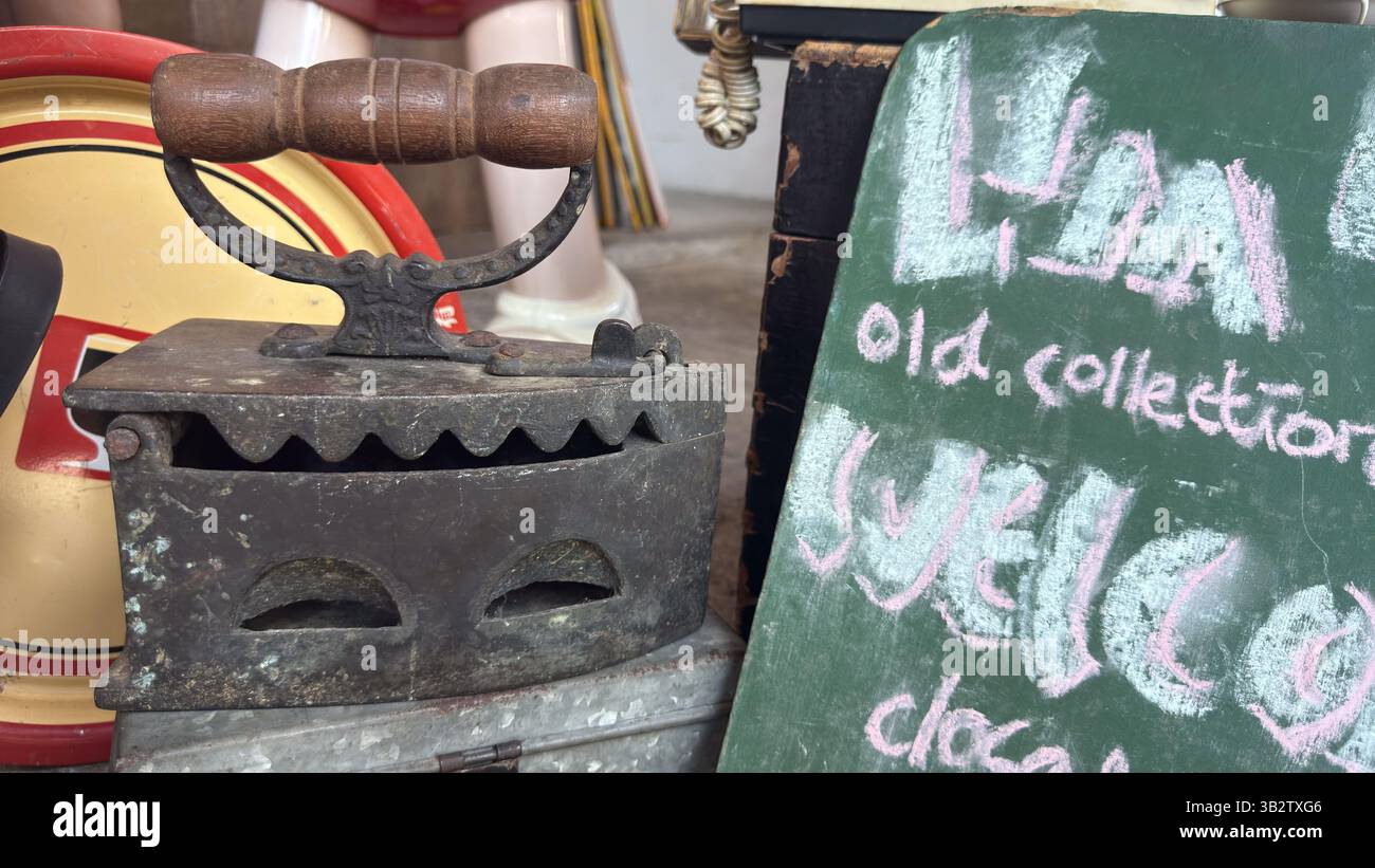 Vintage iron and chalkboard display at antique flea market Stock Photo ...
