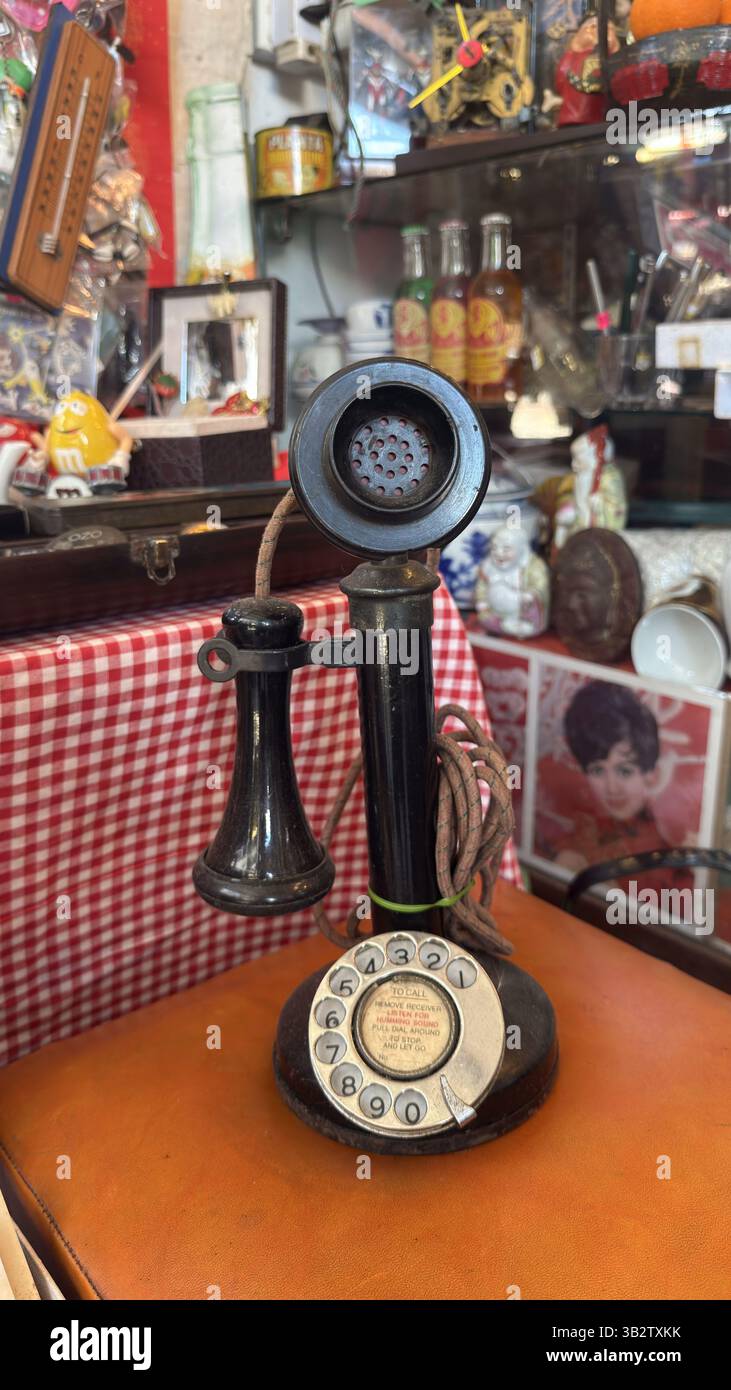 Vintage black rotary telephone on display in an antique shop Stock ...