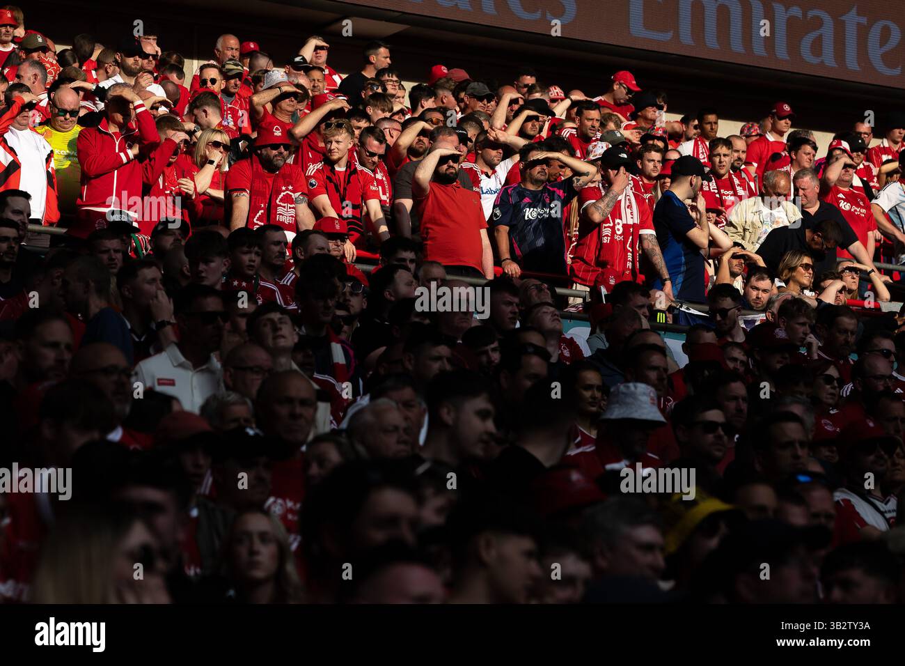 Nottingham Forest fans, supporters watch play from the bright sunshine ...