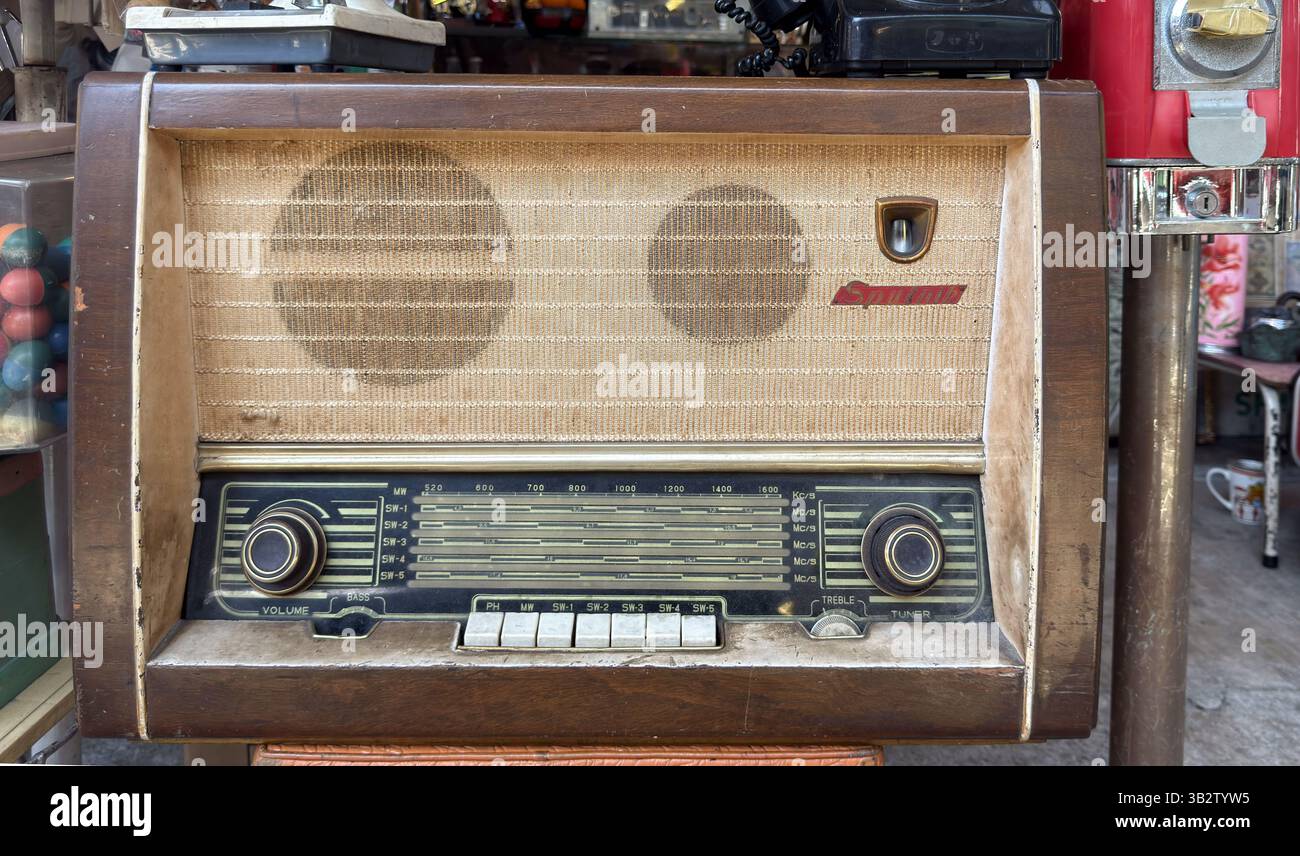 Vintage radio display at a bustling flea market in Penang, Malaysia ...