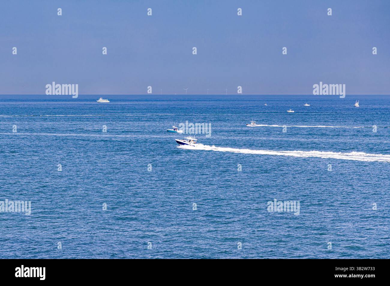boats off montauk point with off shore wind farm in the distance Stock ...