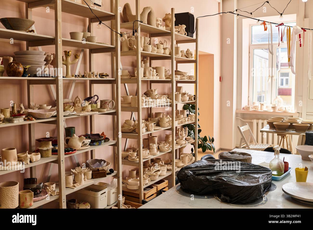 Bright pottery studio features handcrafted pieces and creative tools ...