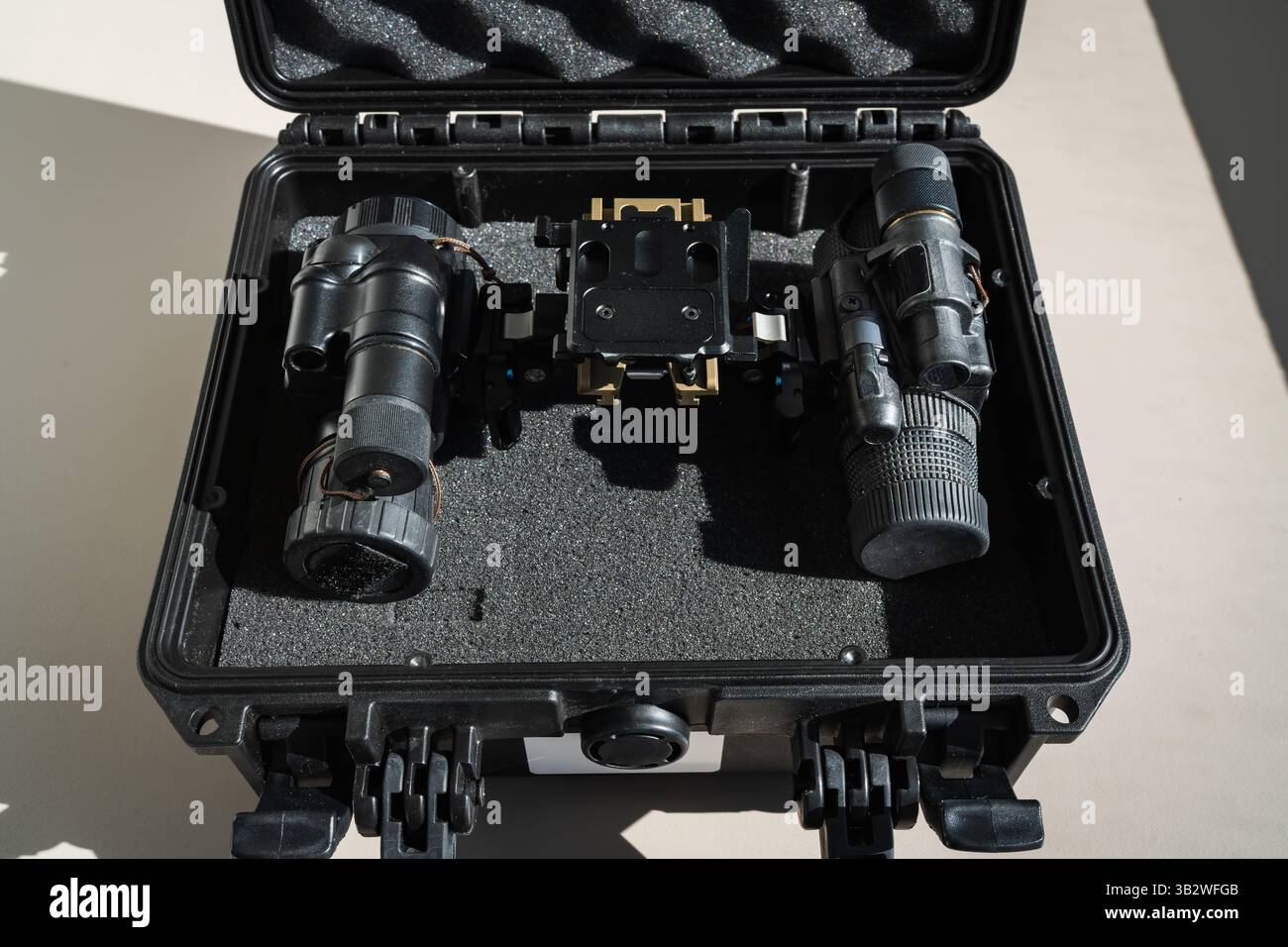 Professional military night vision goggles and mount safely stored in a ...