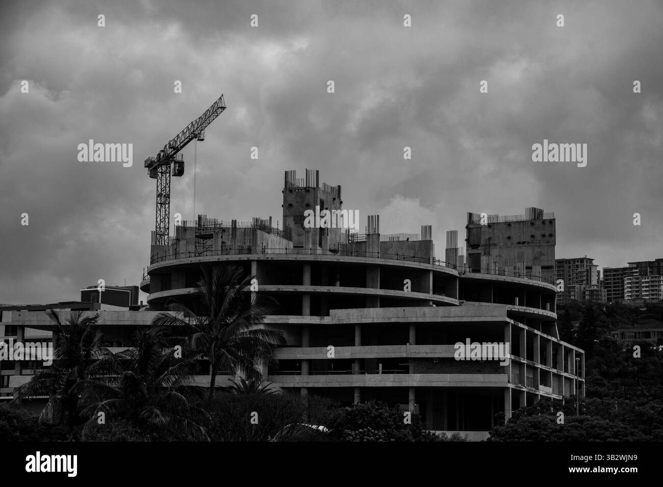 Construction site featuring a partially built multi-story building, a ...