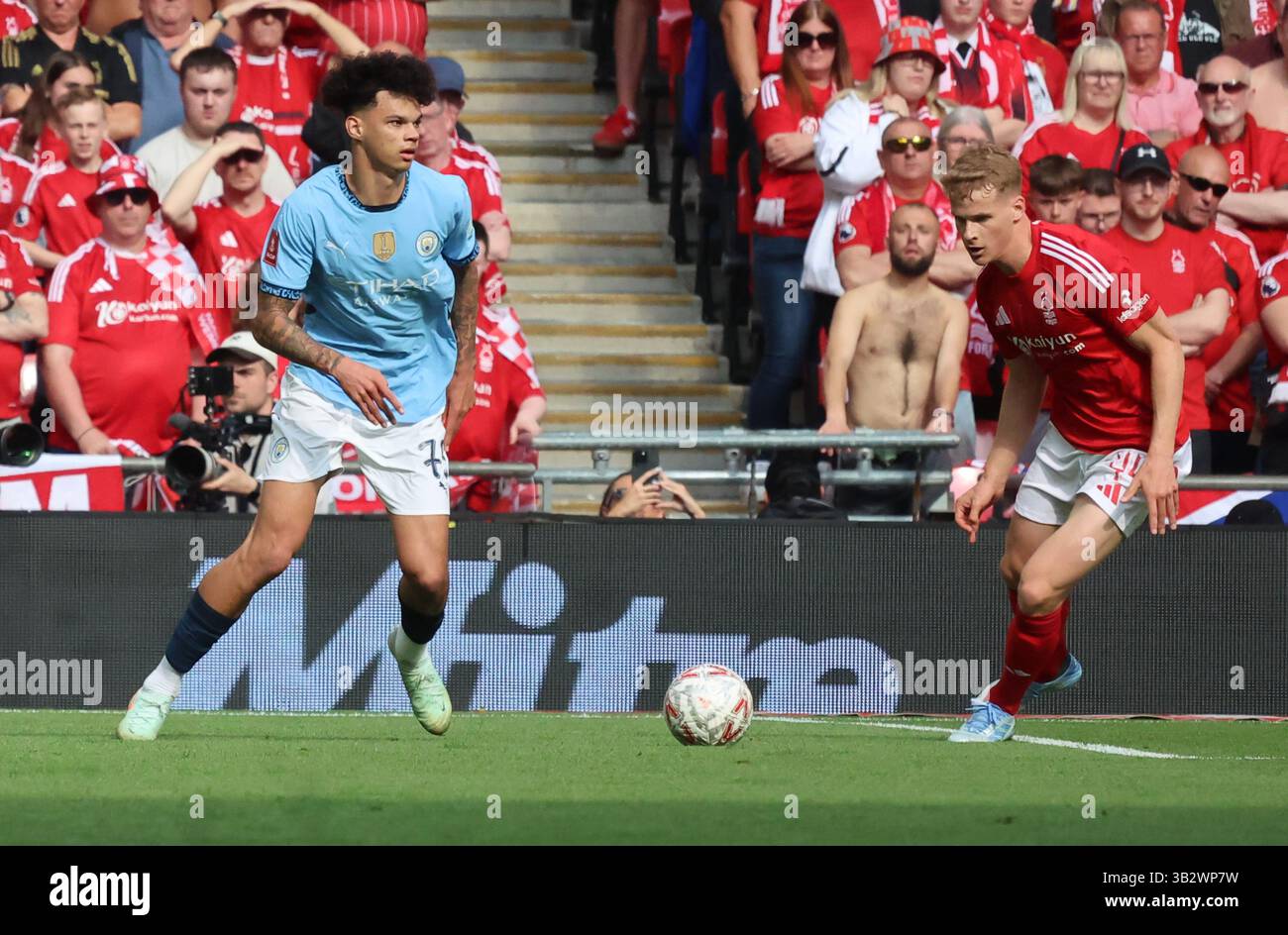 London, UK. 27th Apr, 2025. Nico O'Reilly of Manchester City and Zach ...