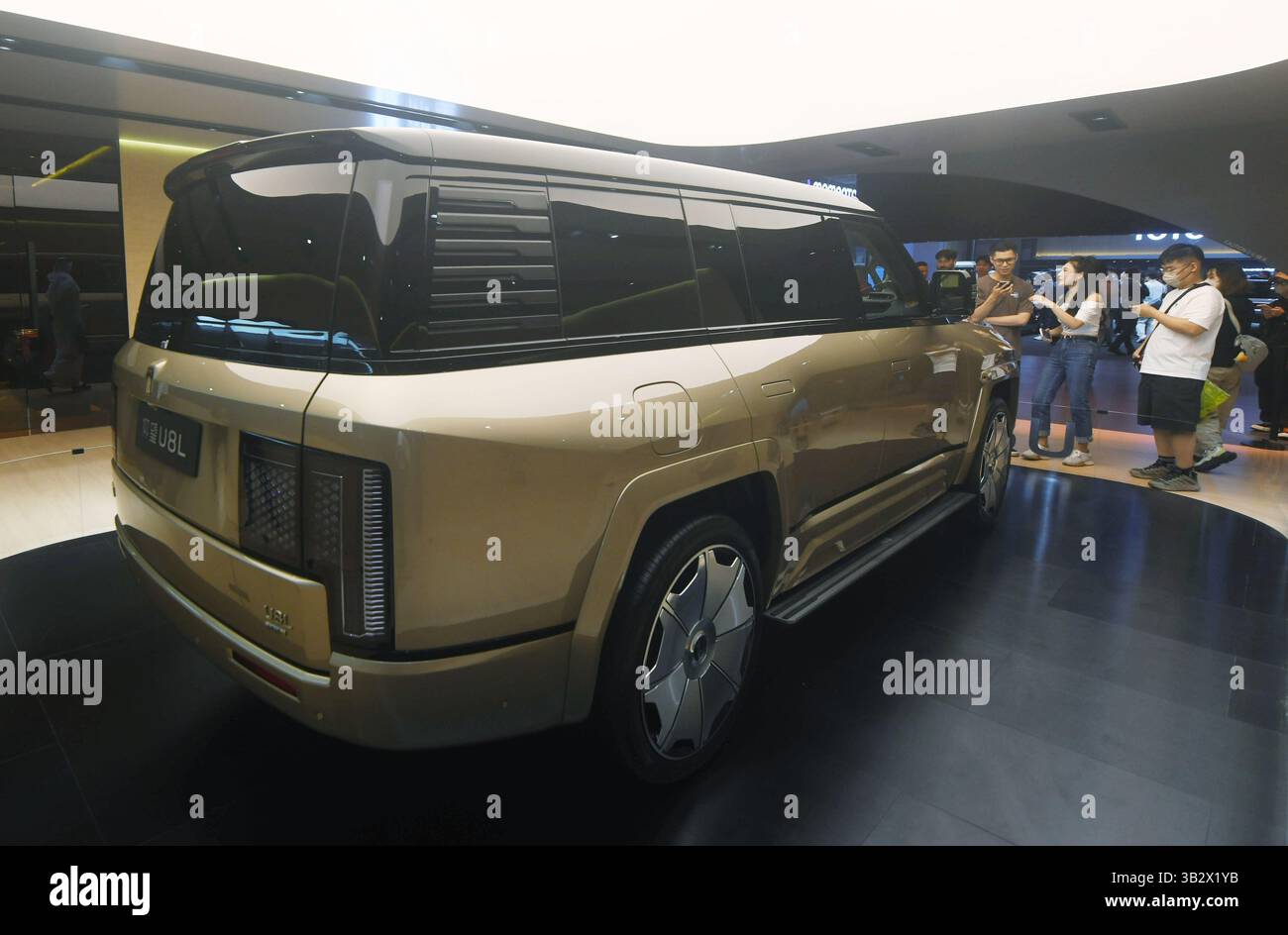 Visitors are viewing a BYD Yuangwang U8L model at 2025 Shanghai International Auto Show in ...