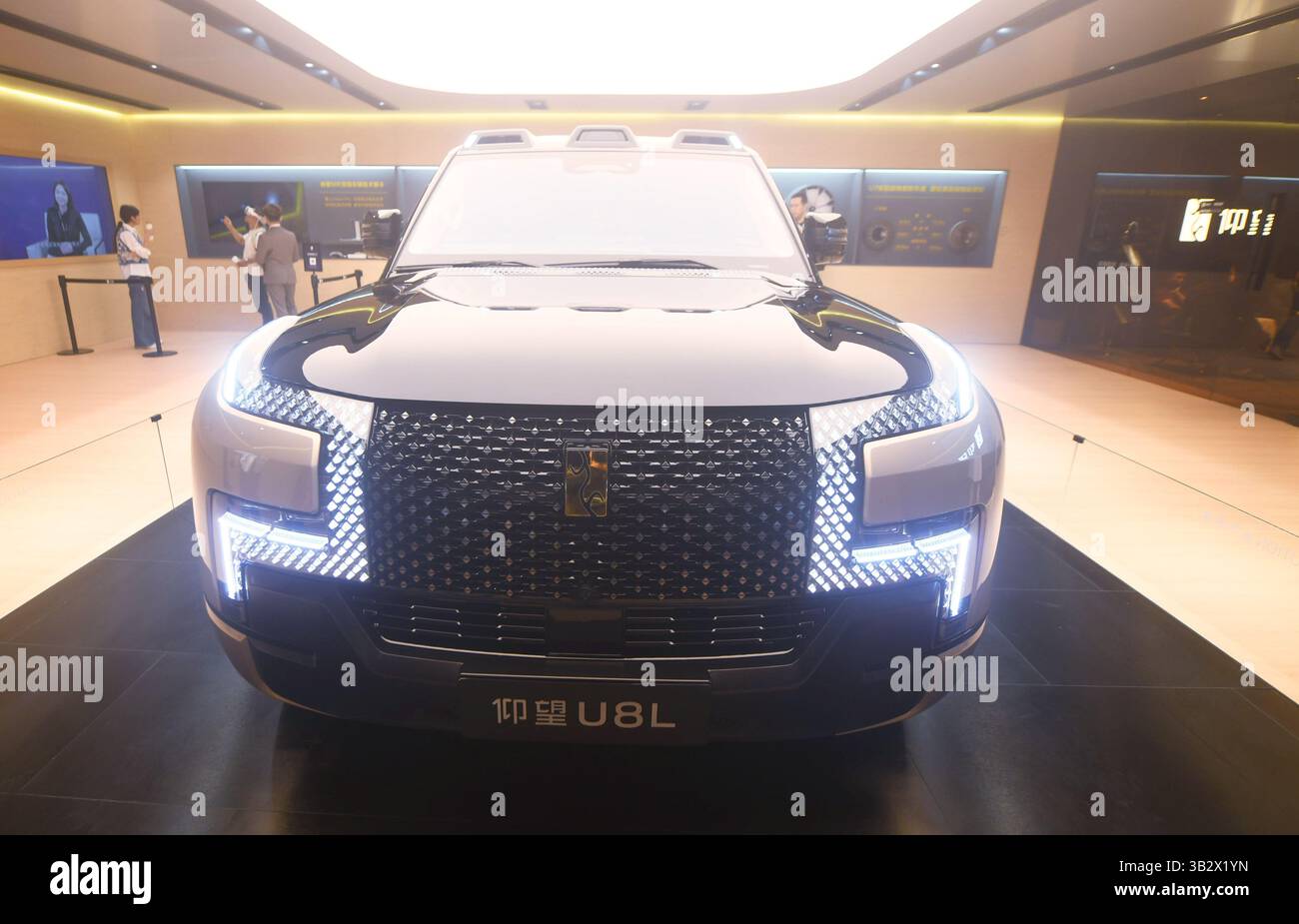 Visitors are viewing a BYD Yuangwang U8L model at 2025 Shanghai International Auto Show in ...
