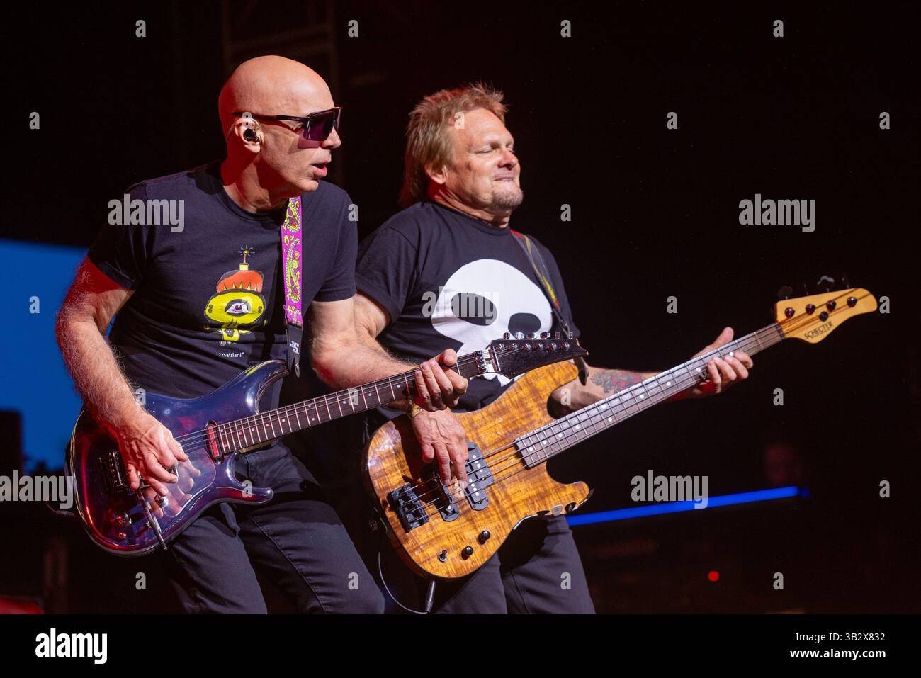 Joe Satriani and Michael Anthony perform with Sammy Hagar during the ...